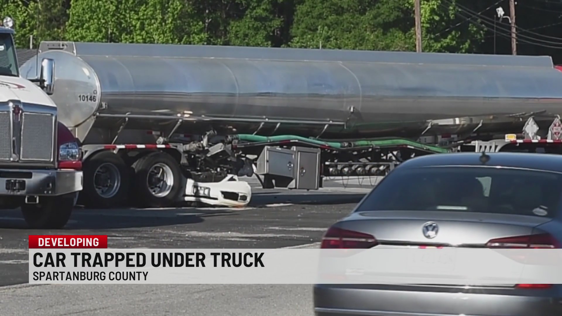 Car trapped under truck in Spartanburg Co. – WSPA 7NEWS