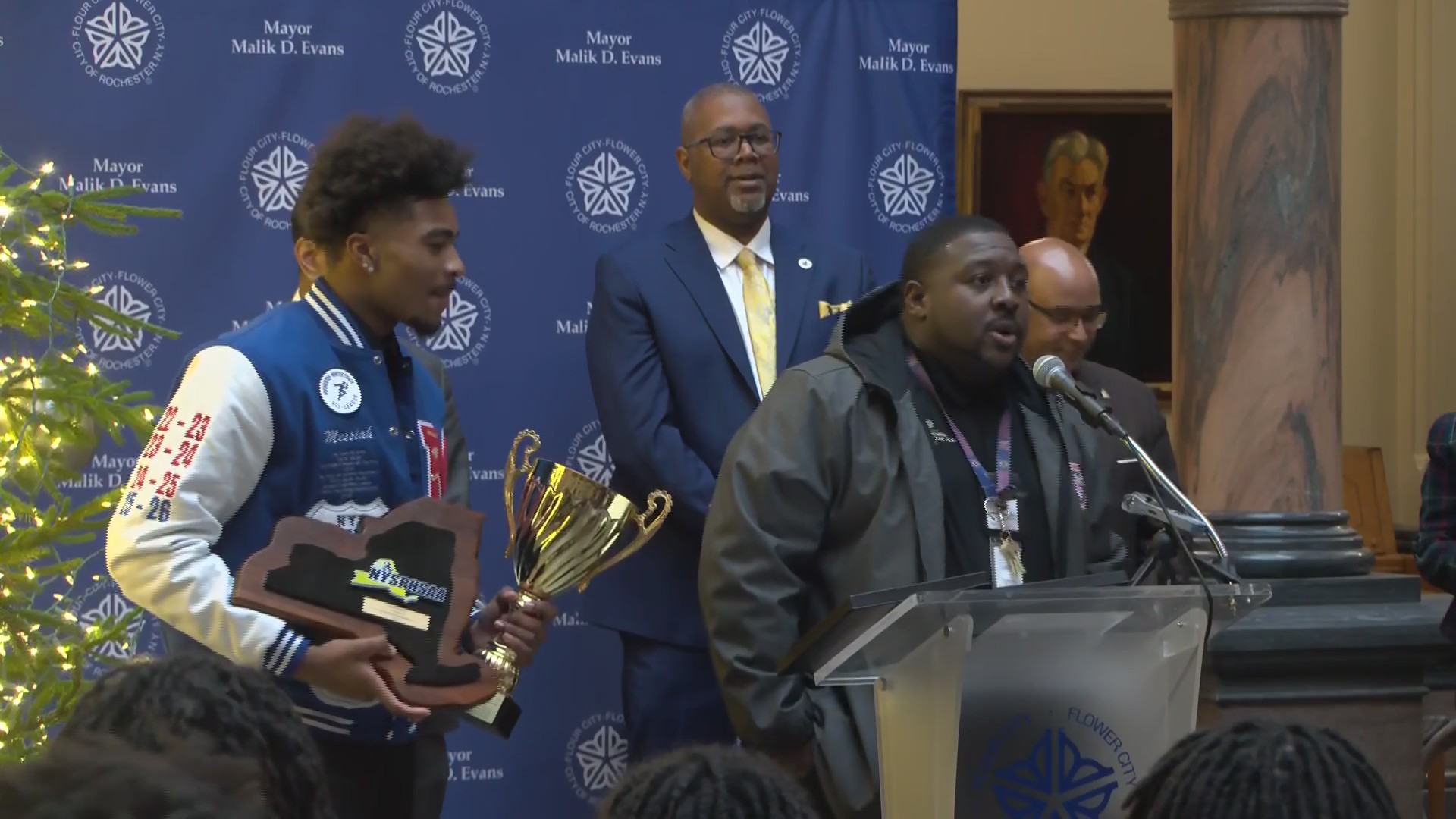 Monroe High’s Coach Cunningham presented with trophy from Mayor Evans ...